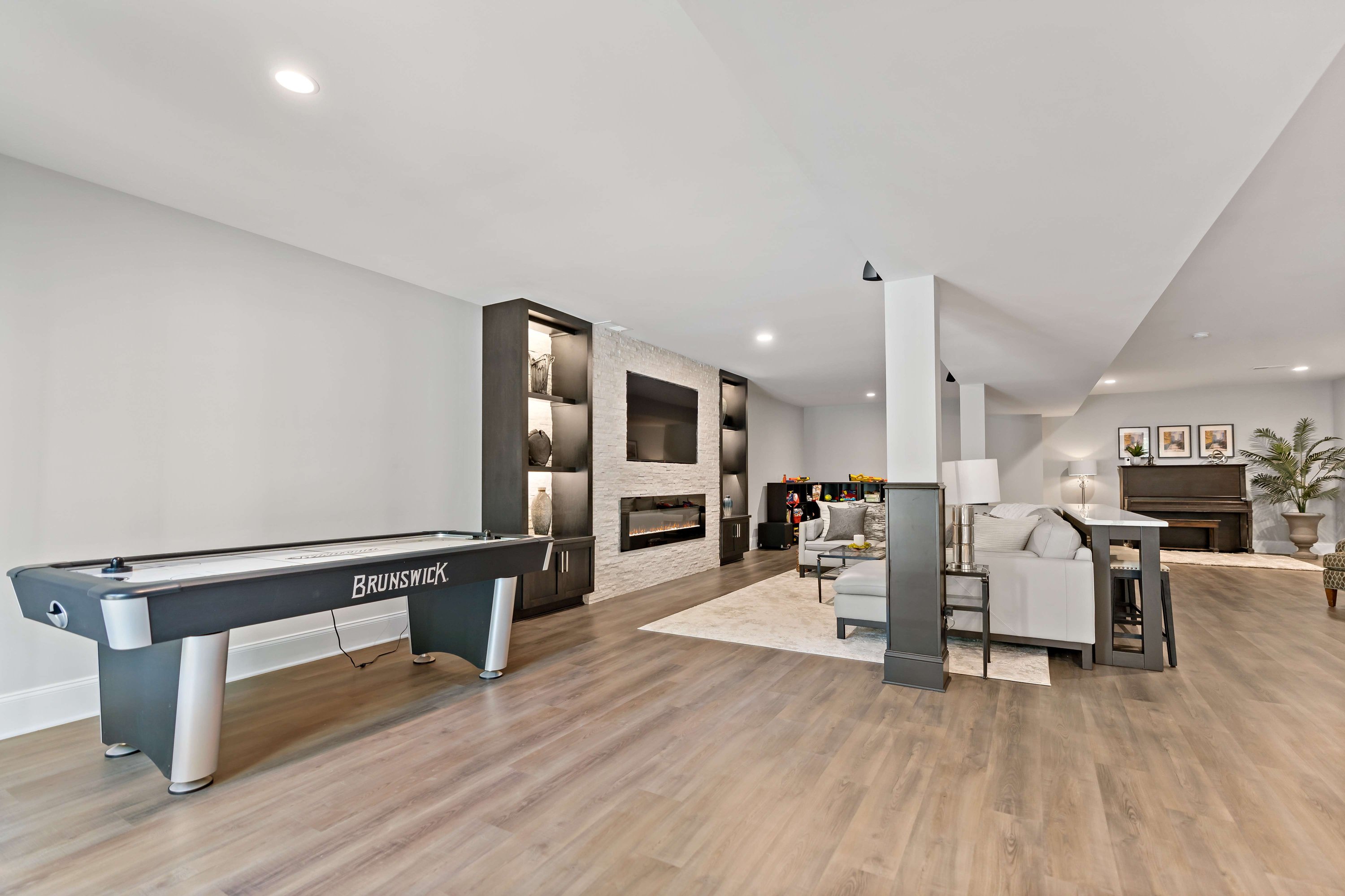 Stunning Haymarket Basement Remodel Showcases Welcoming Wet Bar and ...