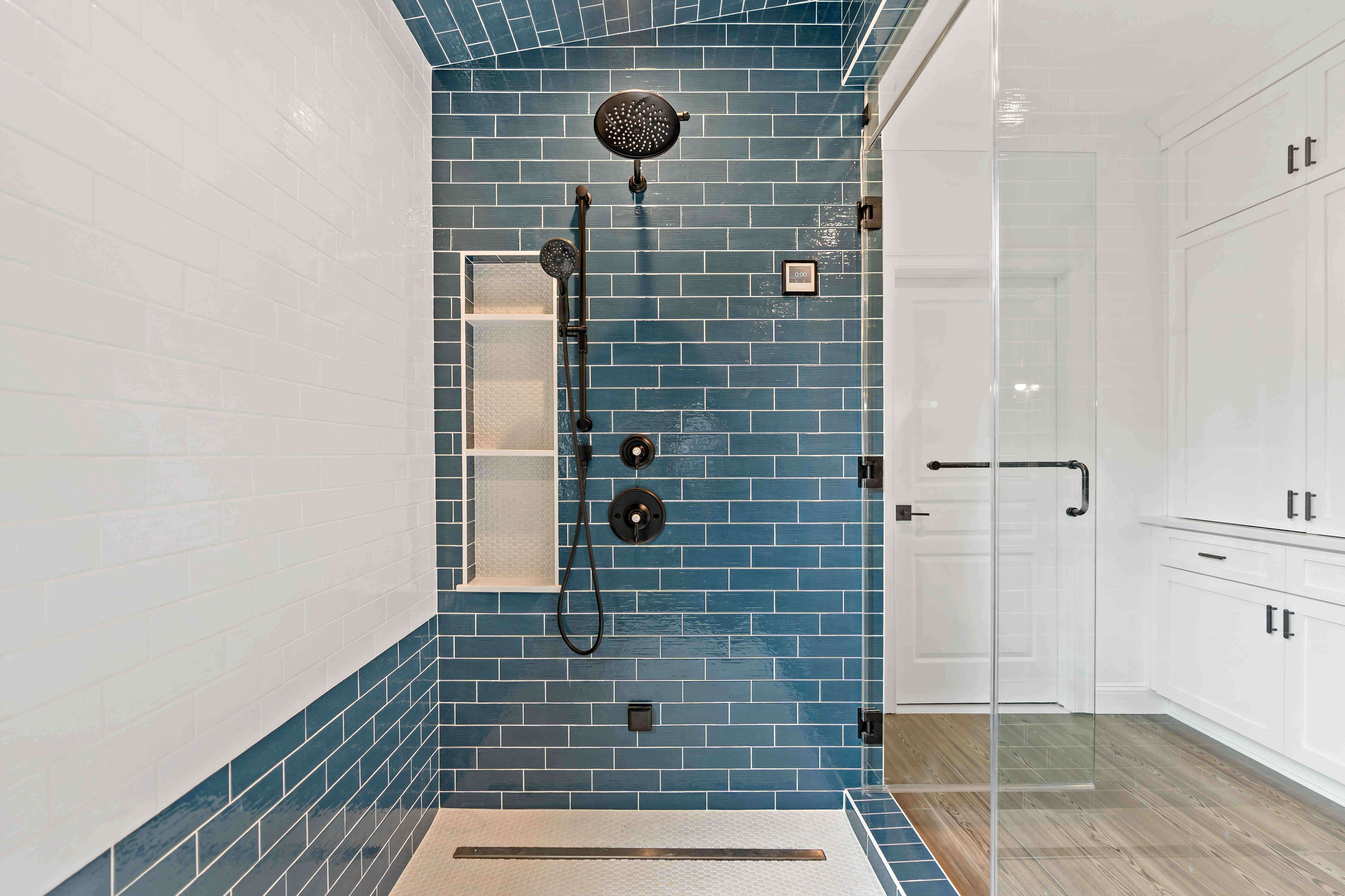 Stunning Blue Tile, Shower Bench, and Steam Shower Functionality ...